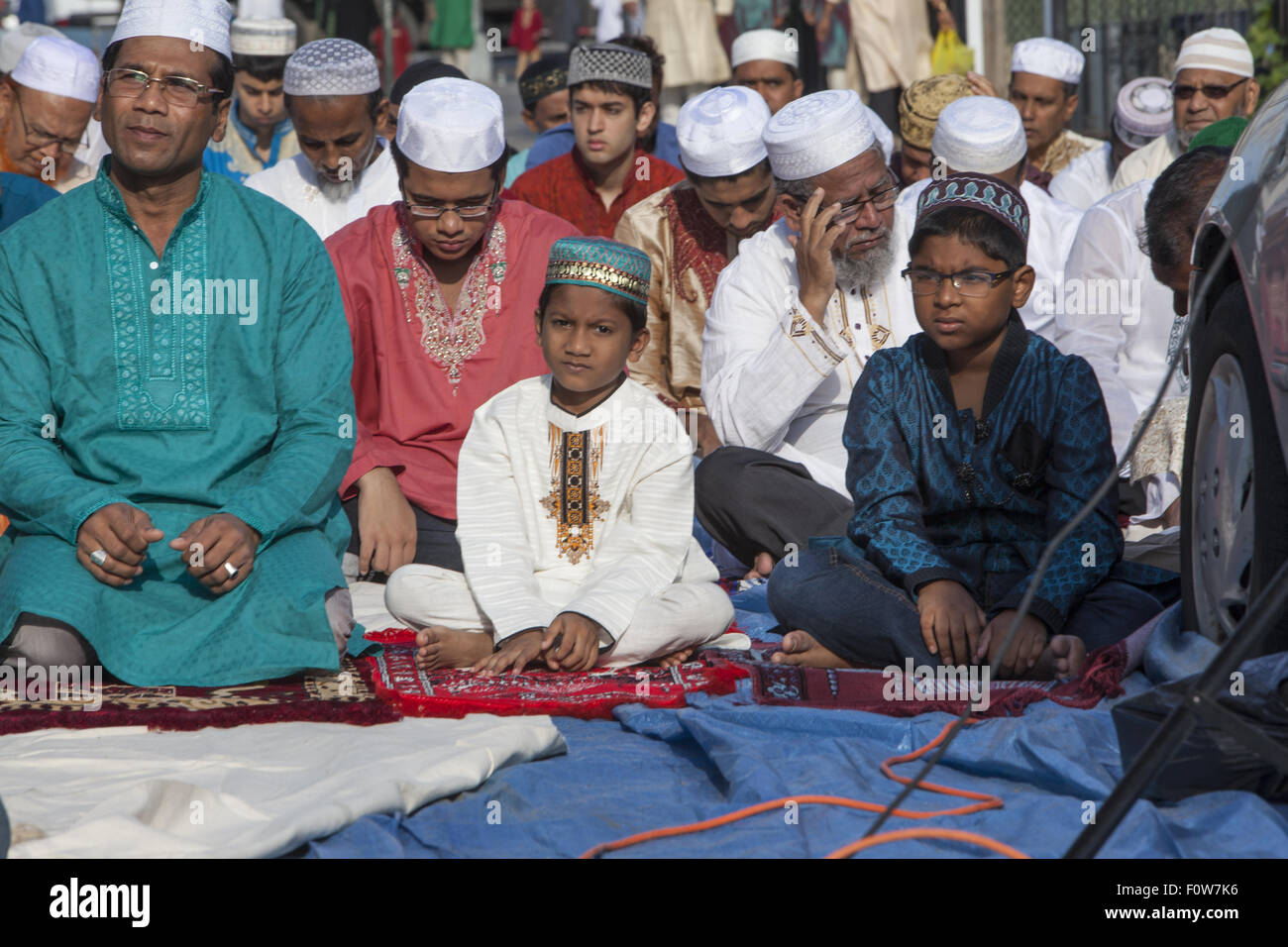 Muslims pray outside a mosque in Kensington, Brooklyn, NY for "Eid al ...