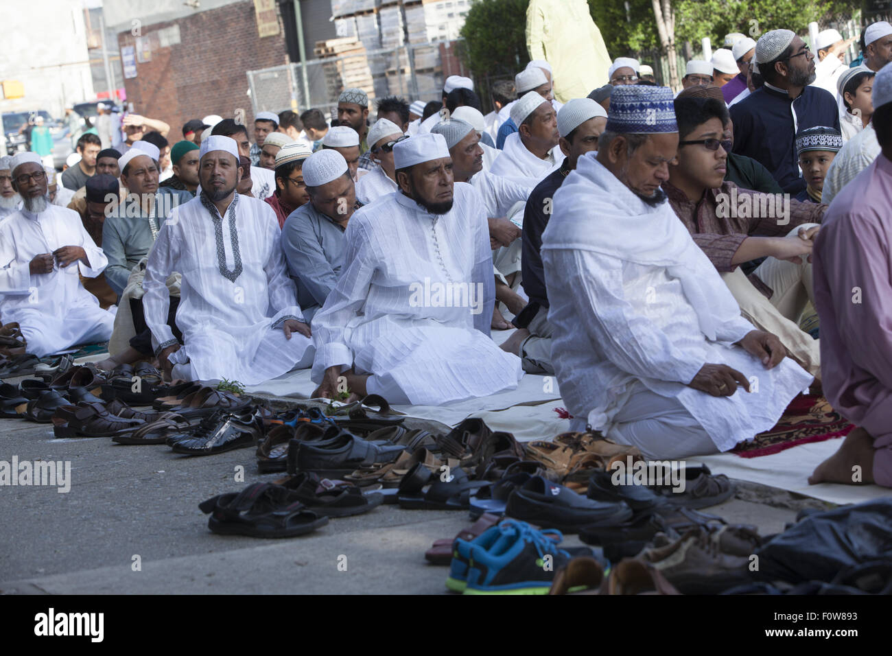 Muslims pray outside a mosque in Kensington, Brooklyn, NY for "Eid al ...