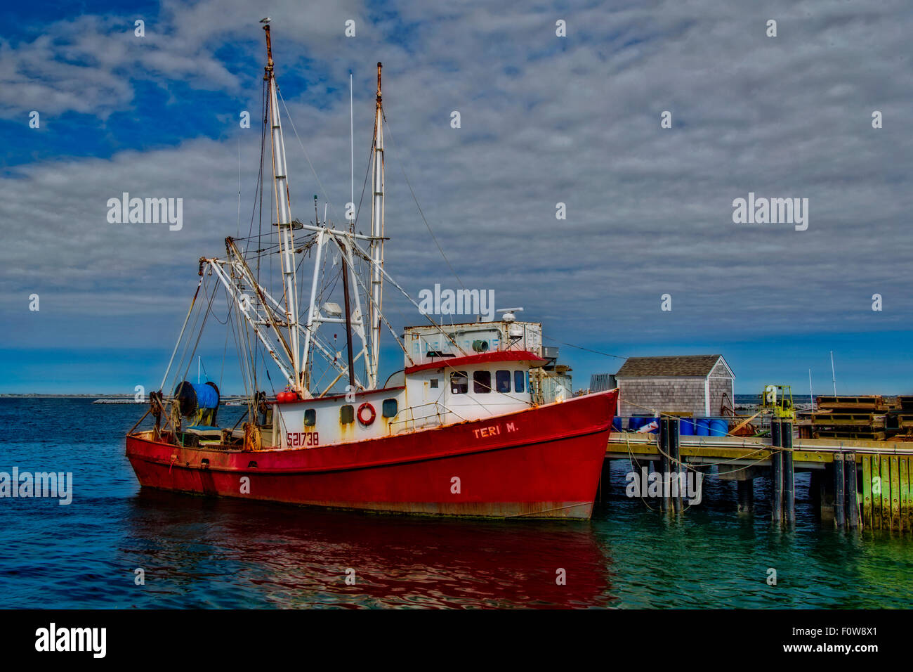 A colorful fishing troller docked at the P-Town Harbor in Cape Cod ...