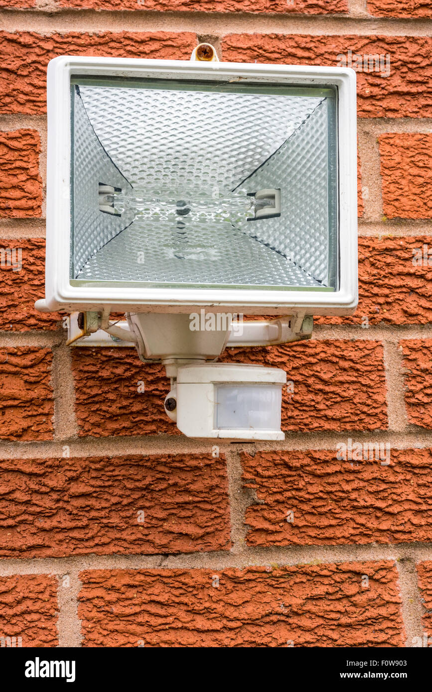 A security light with an automatic motion detection sensor on the side ...