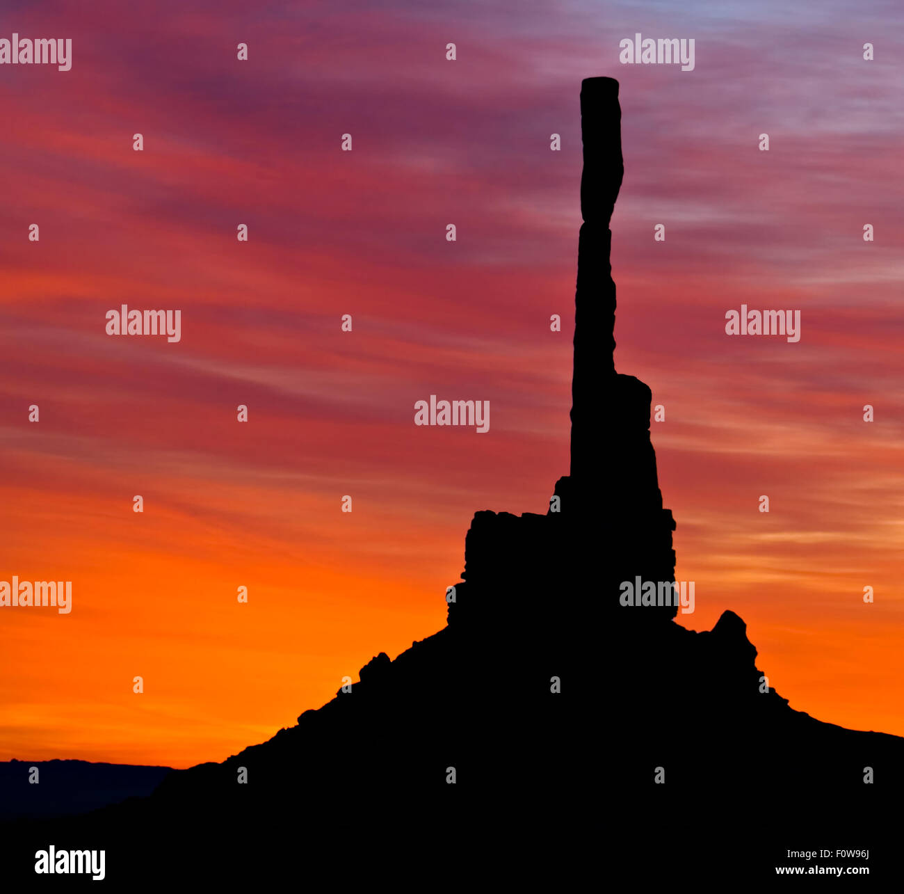 Totem Pole silhouetted at sunrise in Monument Valley National Park ...