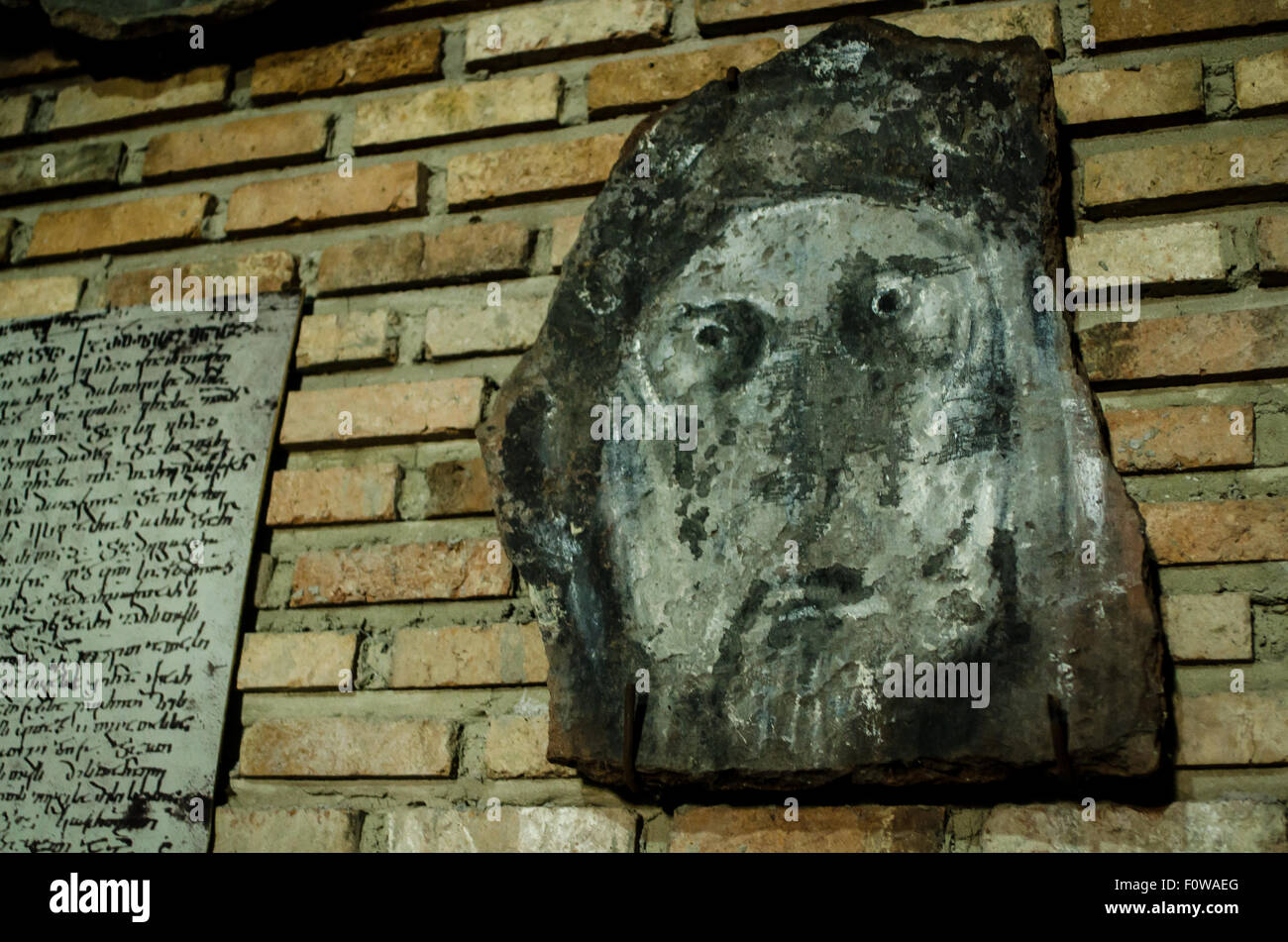 Masks on a brick wall hi-res stock photography and images - Alamy