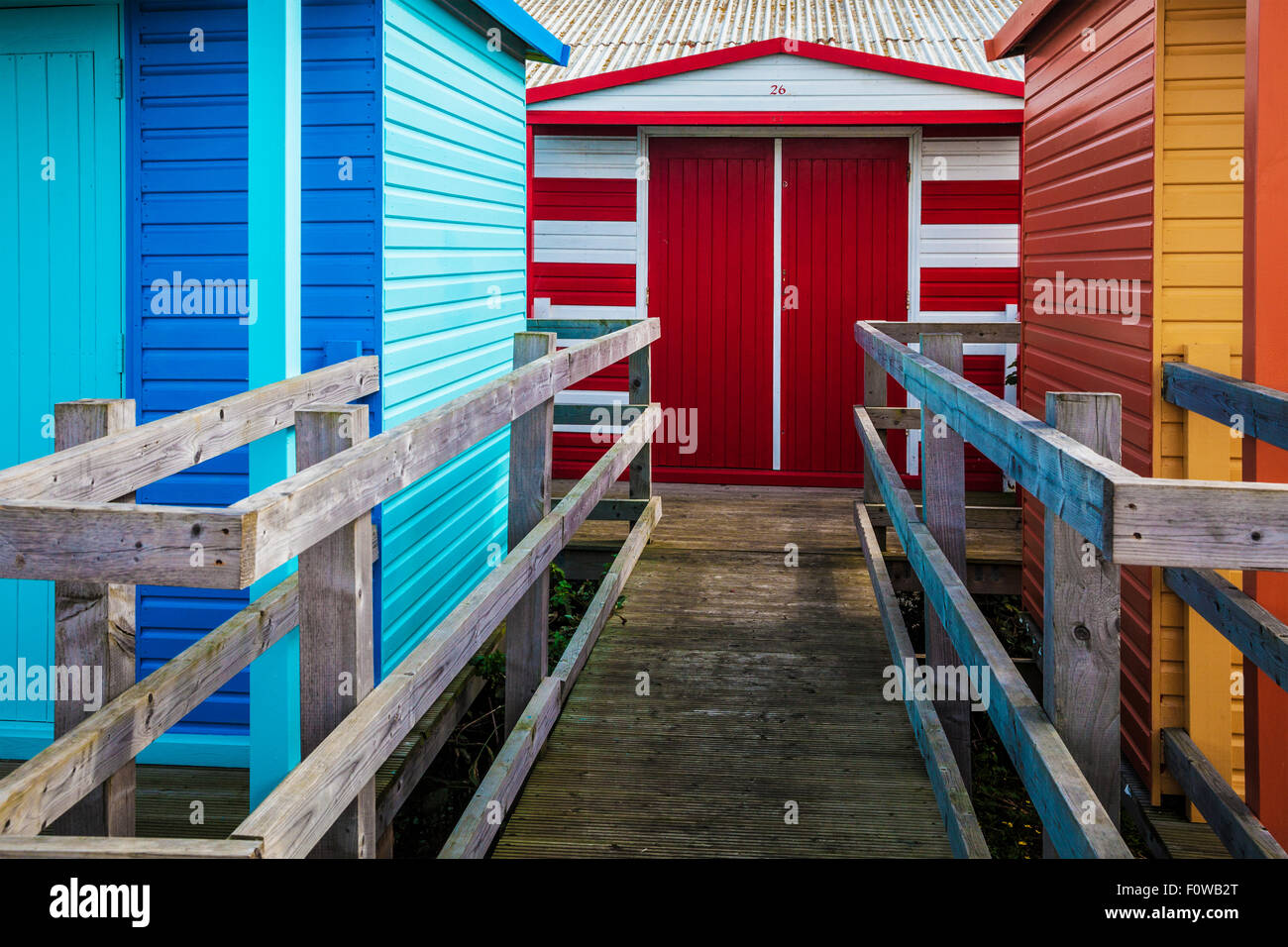 Colourful wooden beach huts in the Kentish coastal resort of Whitstable ...