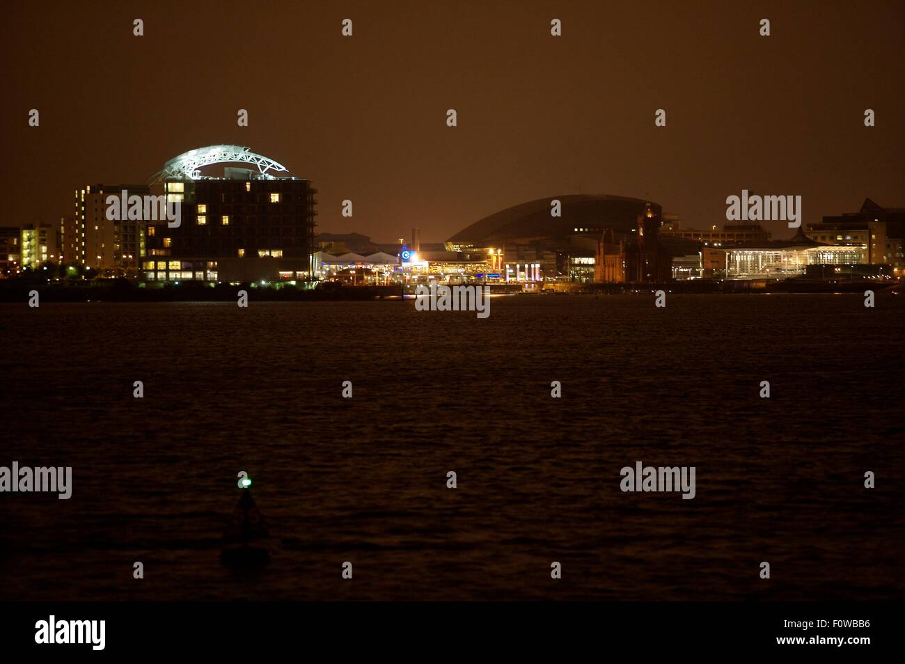 Cardiff city skyline at night across Cardiff Bay Stock Photo - Alamy