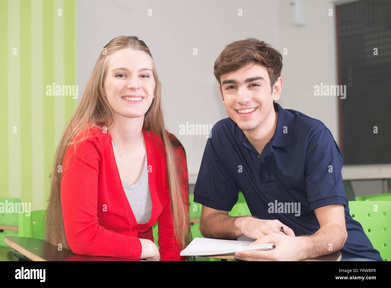 Boy and girl studying together Stock Photo - Alamy