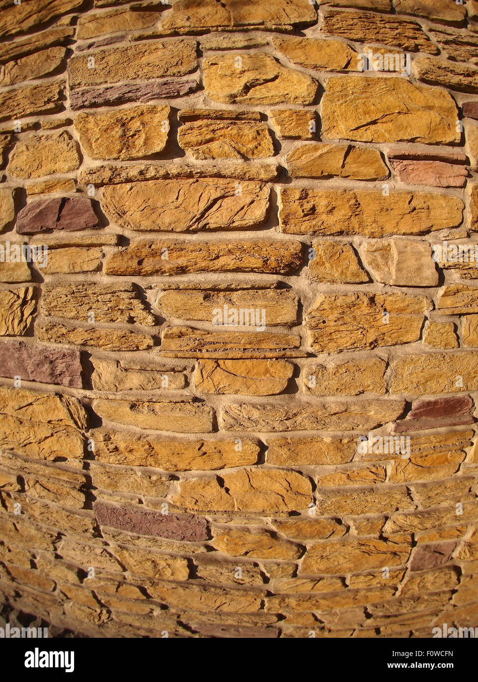 Decorative stone wall yellow with wide angle fisheye lens view Stock ...