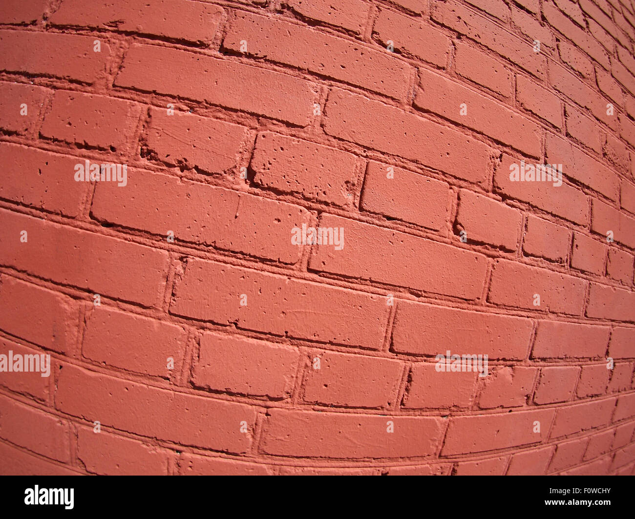 A fragment of a brick wall painted with wide angle fisheye lens ...