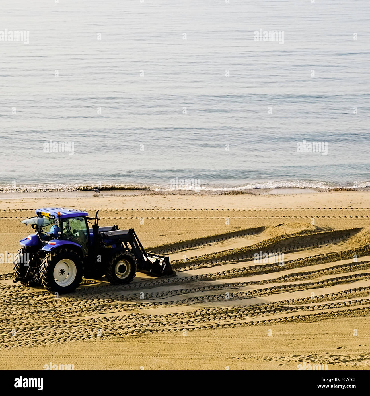 Tractor on the beach Stock Photo - Alamy