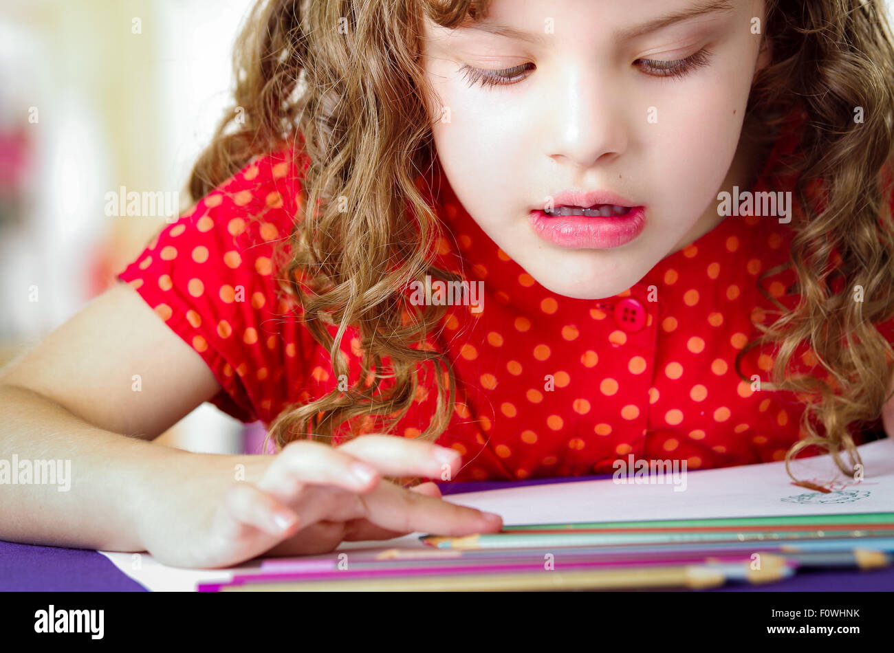 Cute little girl doing her homework Stock Photo - Alamy