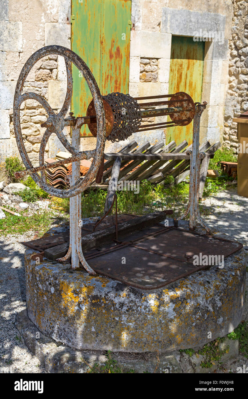 Old French village buildings and water well, Genac, Poitiers Charente ...