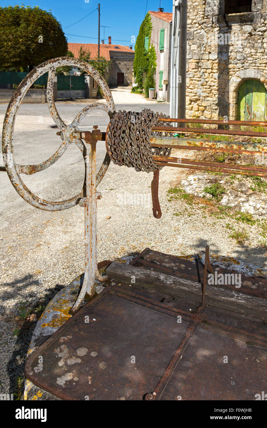 Old French village buildings and well, Genac, Poitiers Charente, south ...