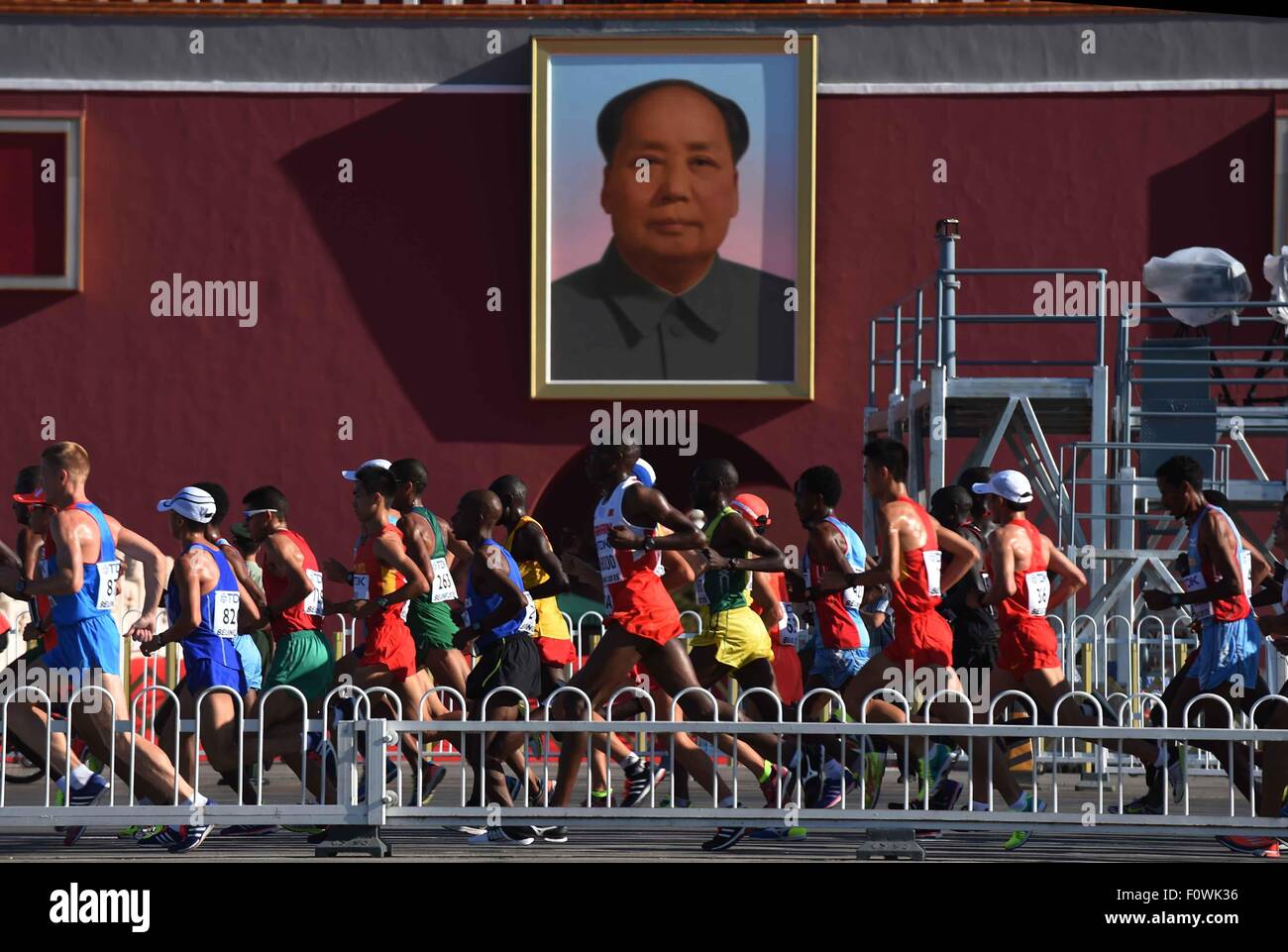 Beijing, China. 22nd August, 2015. Athletes run through the Tian'anmen ...