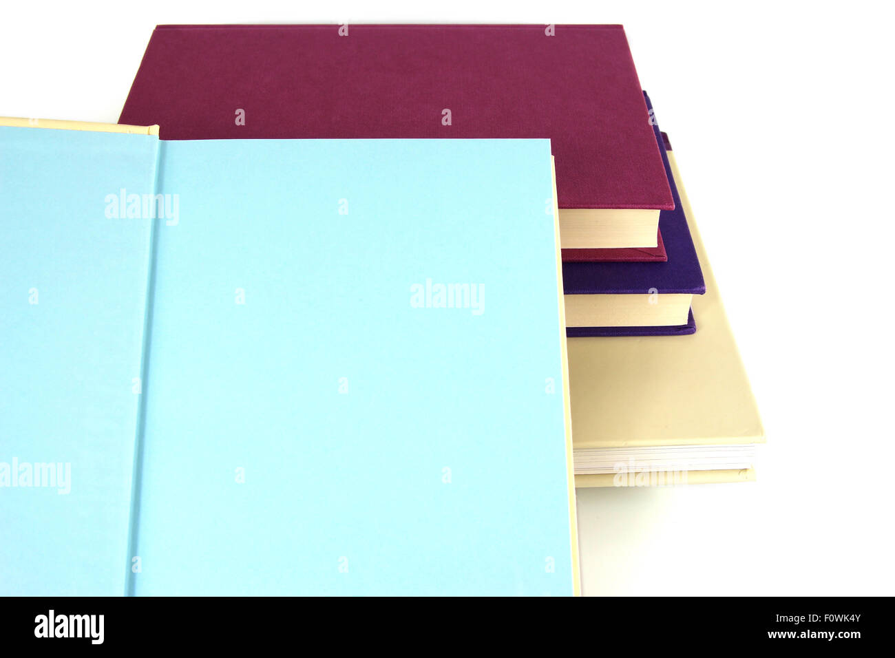Pile of books, open book with blank pages. Copy Space on white ... Pile of books, open book with blank pages. Copy Space on white ...