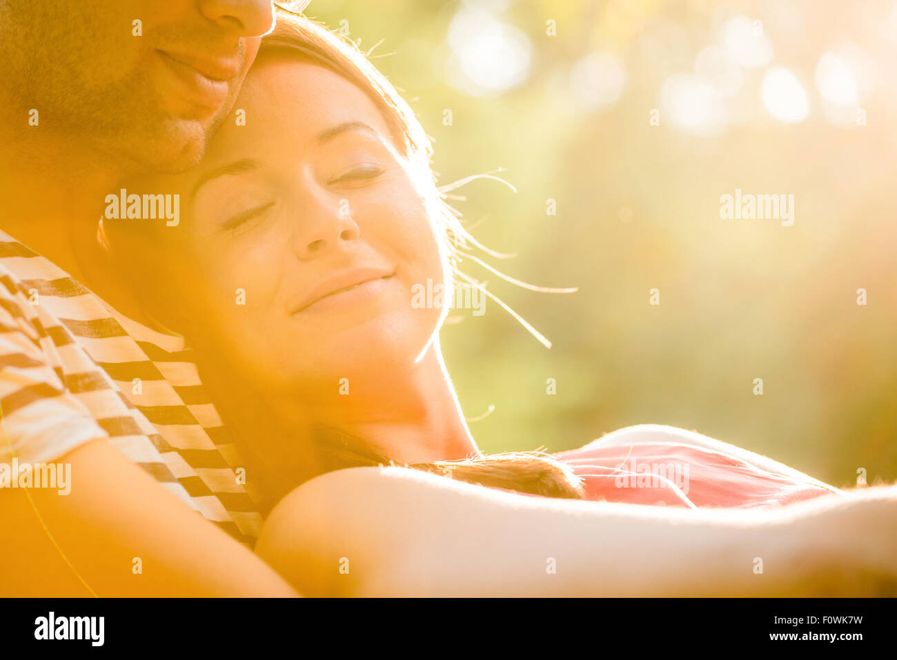 Intimate moments - young couple embracing and hugging in nature Stock ...