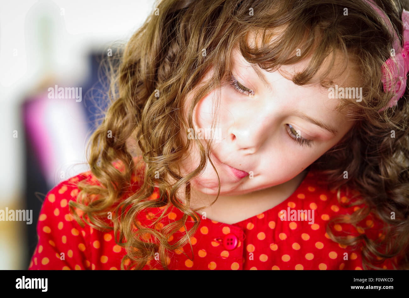 Beautiful girl making faces as she works Stock Photo - Alamy