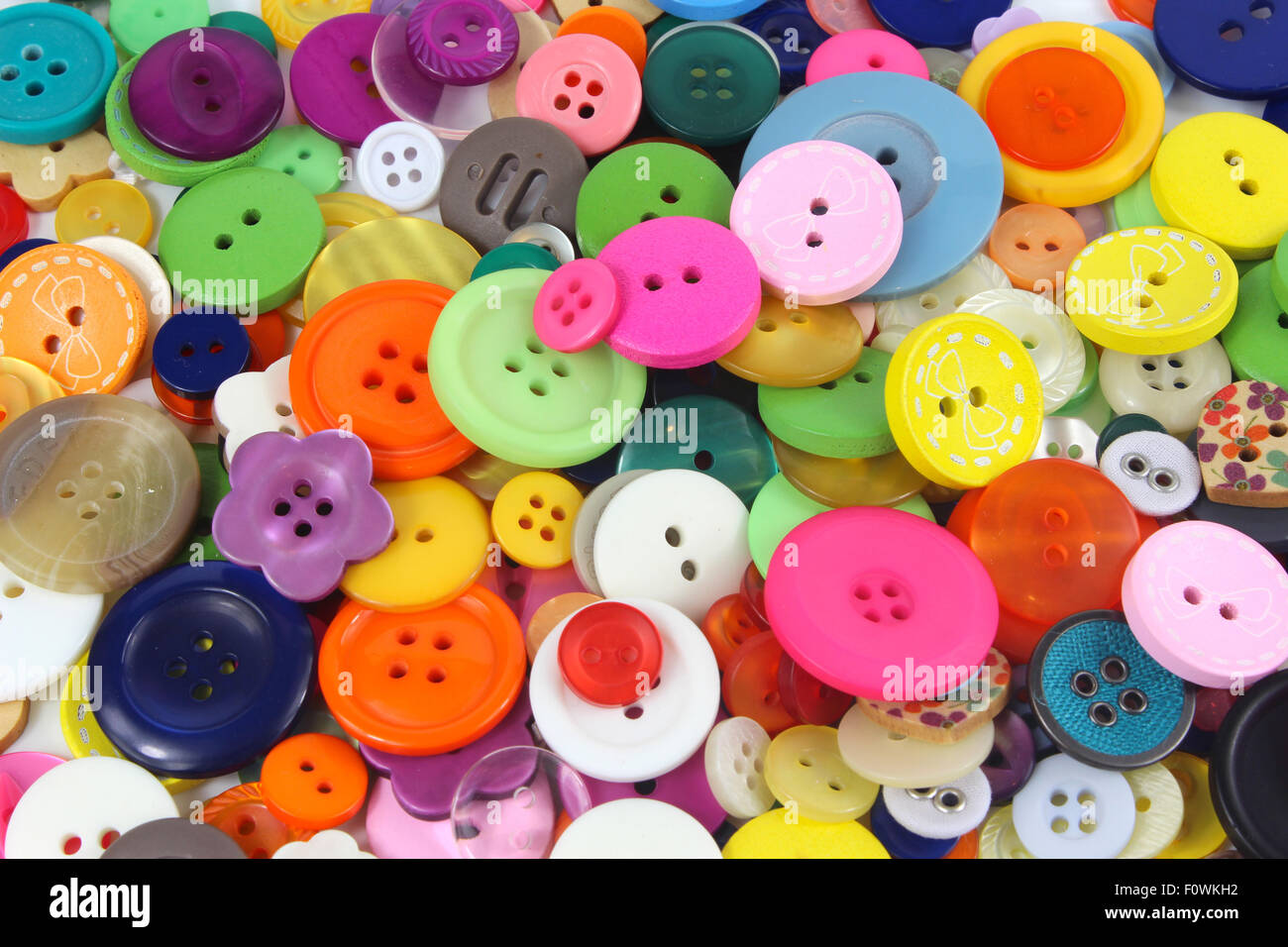 Many coloured sewing buttons Stock Photo - Alamy