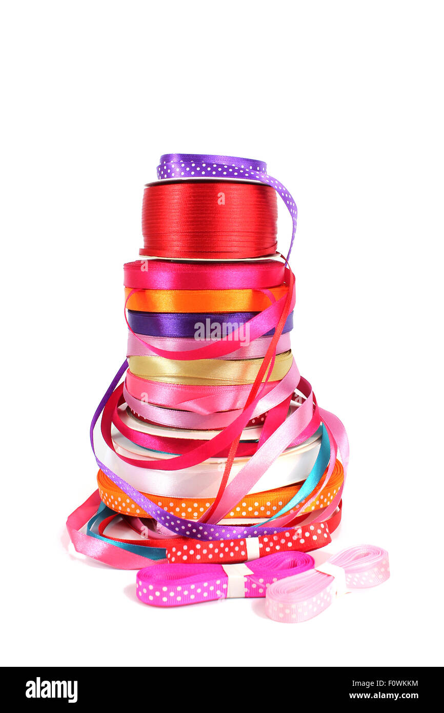 Colorful stack of haberdashery ribbons on white background with copy ...