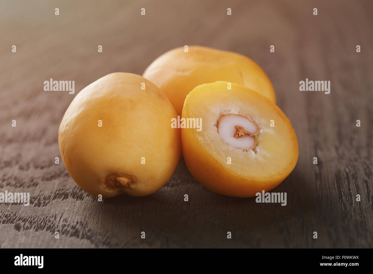 fresh raw dates on table old oak wood Stock Photo - Alamy