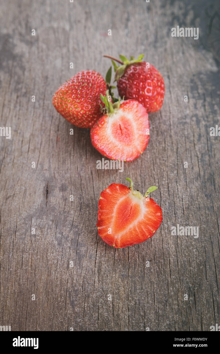 fresh strawberries on wood table Stock Photo - Alamy