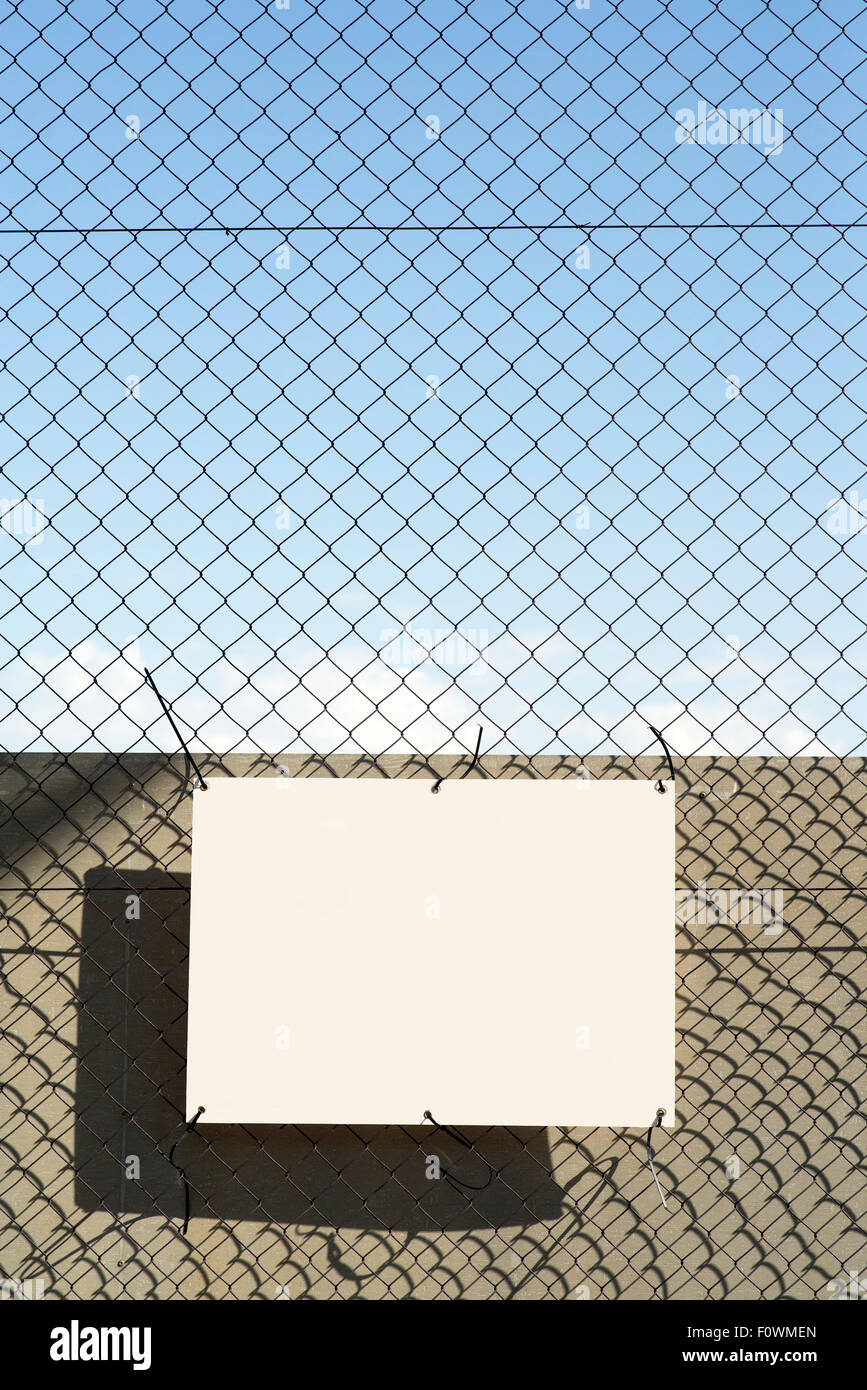 white sign on a metal fence Stock Photo - Alamy