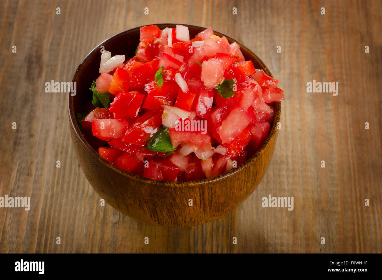 Fresh salsa dip on a wooden table. Selective focus Stock Photo - Alamy
