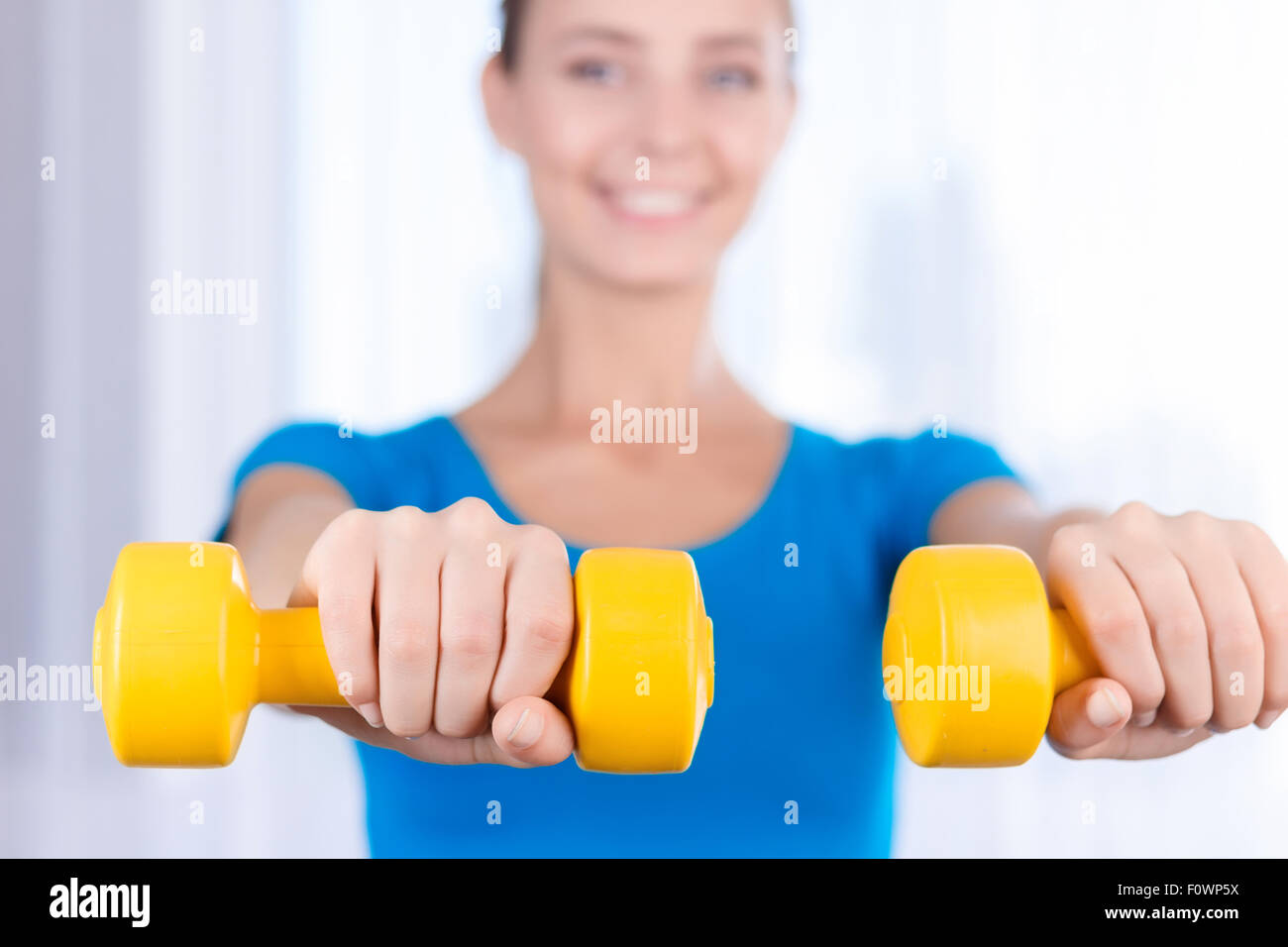 Happy girl doing exercises Stock Photo - Alamy