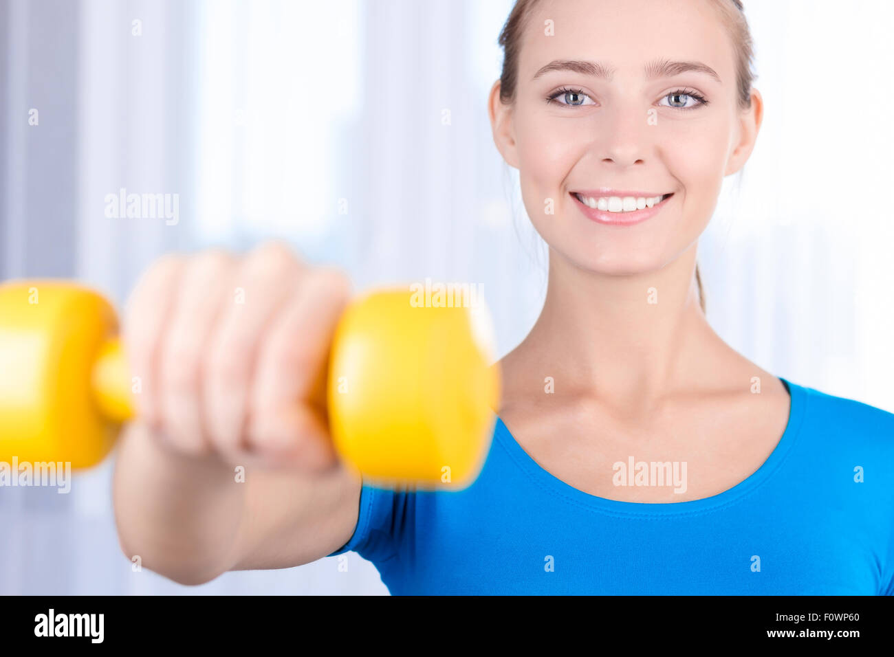 Happy girl doing exercises Stock Photo - Alamy