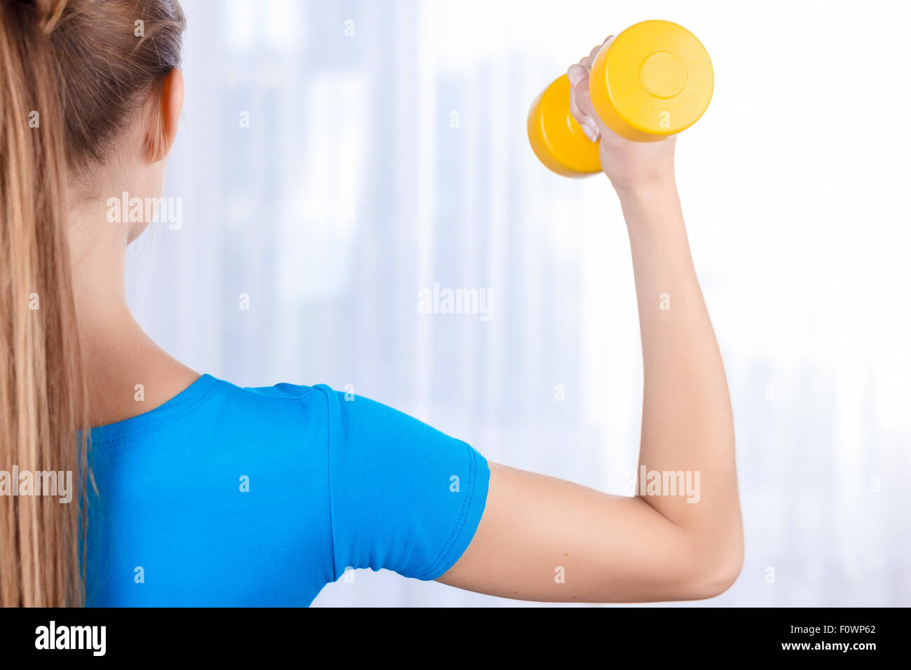 Happy girl doing exercises Stock Photo - Alamy