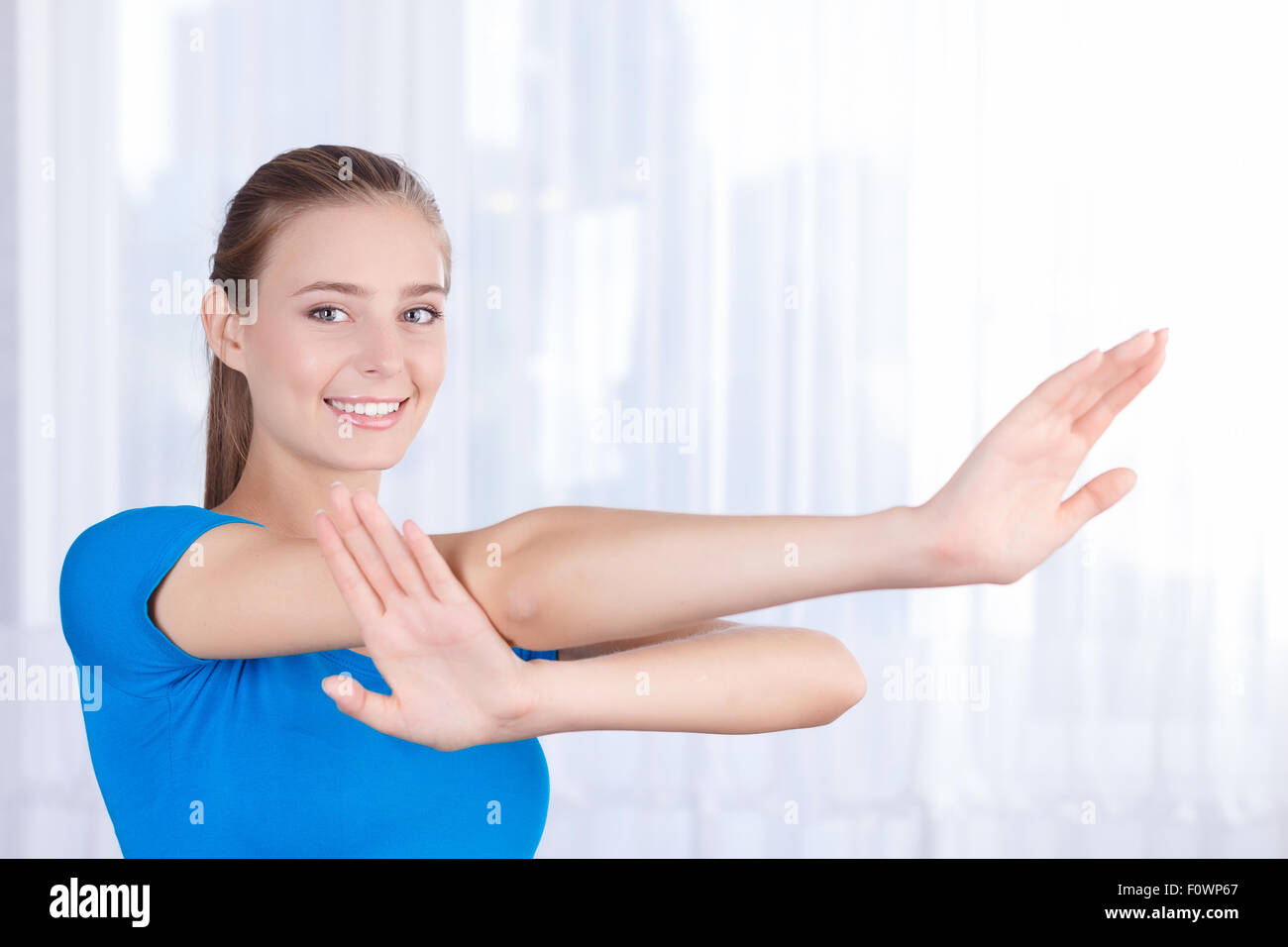 Happy girl doing exercises Stock Photo - Alamy