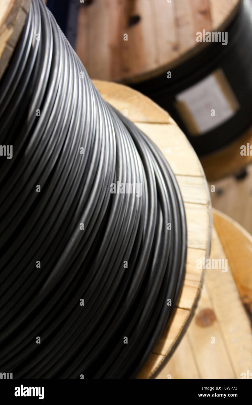 A roll of black electrical cable, close up Stock Photo - Alamy