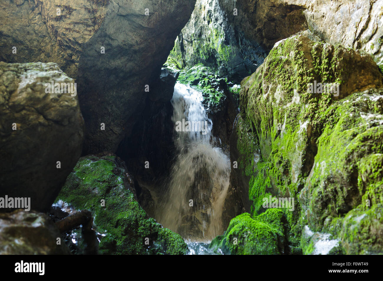 Underground river and waterfall from Cetatile Ponorului cave, Romania ...