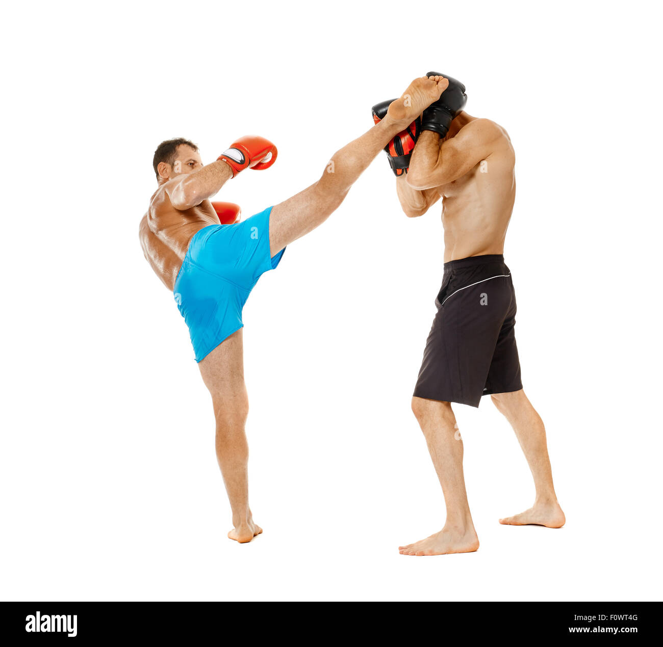Two kickbox fighters sparring, full length isolated on white background ...