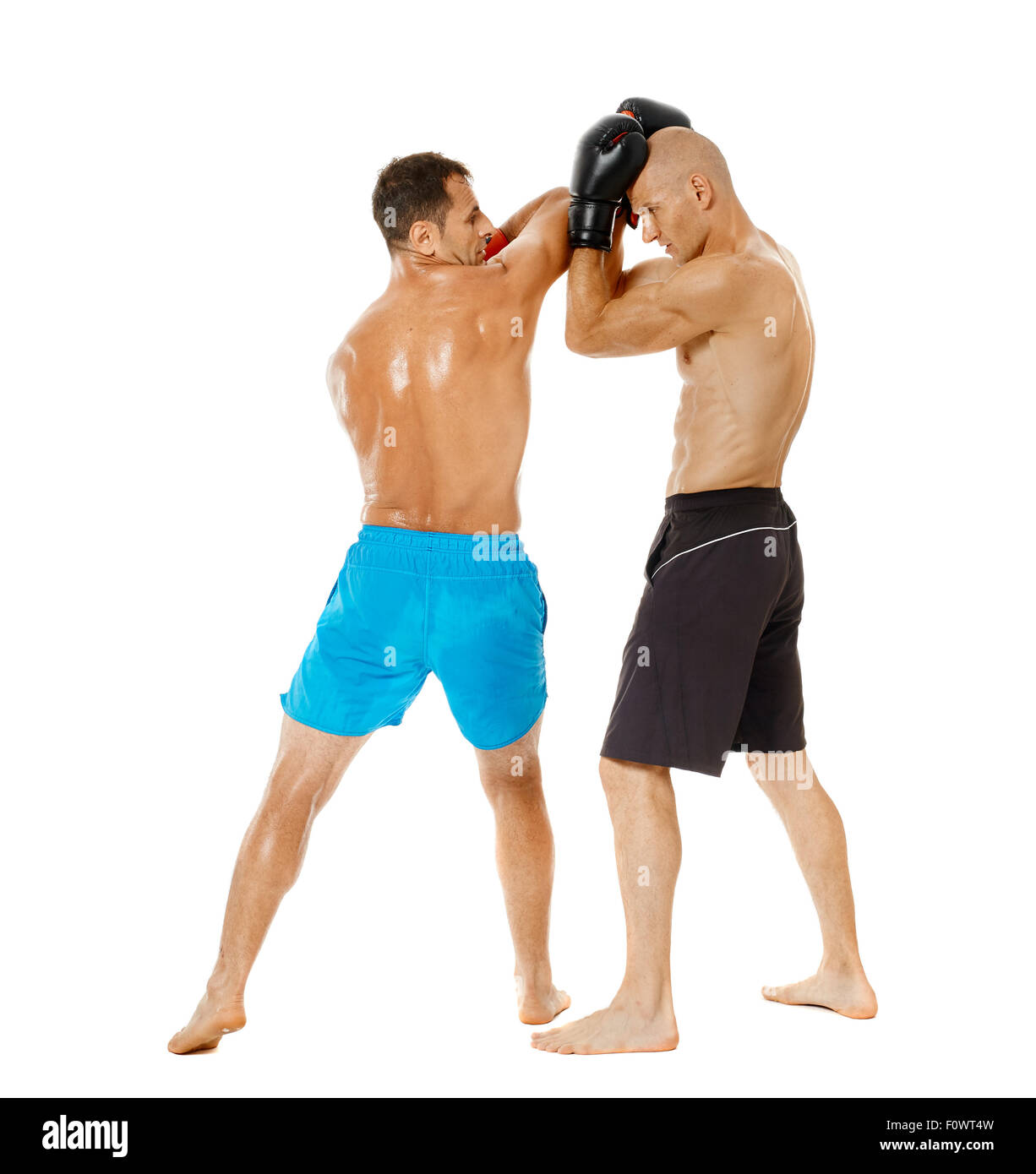 Two kickbox fighters sparring, full length isolated on white background ...