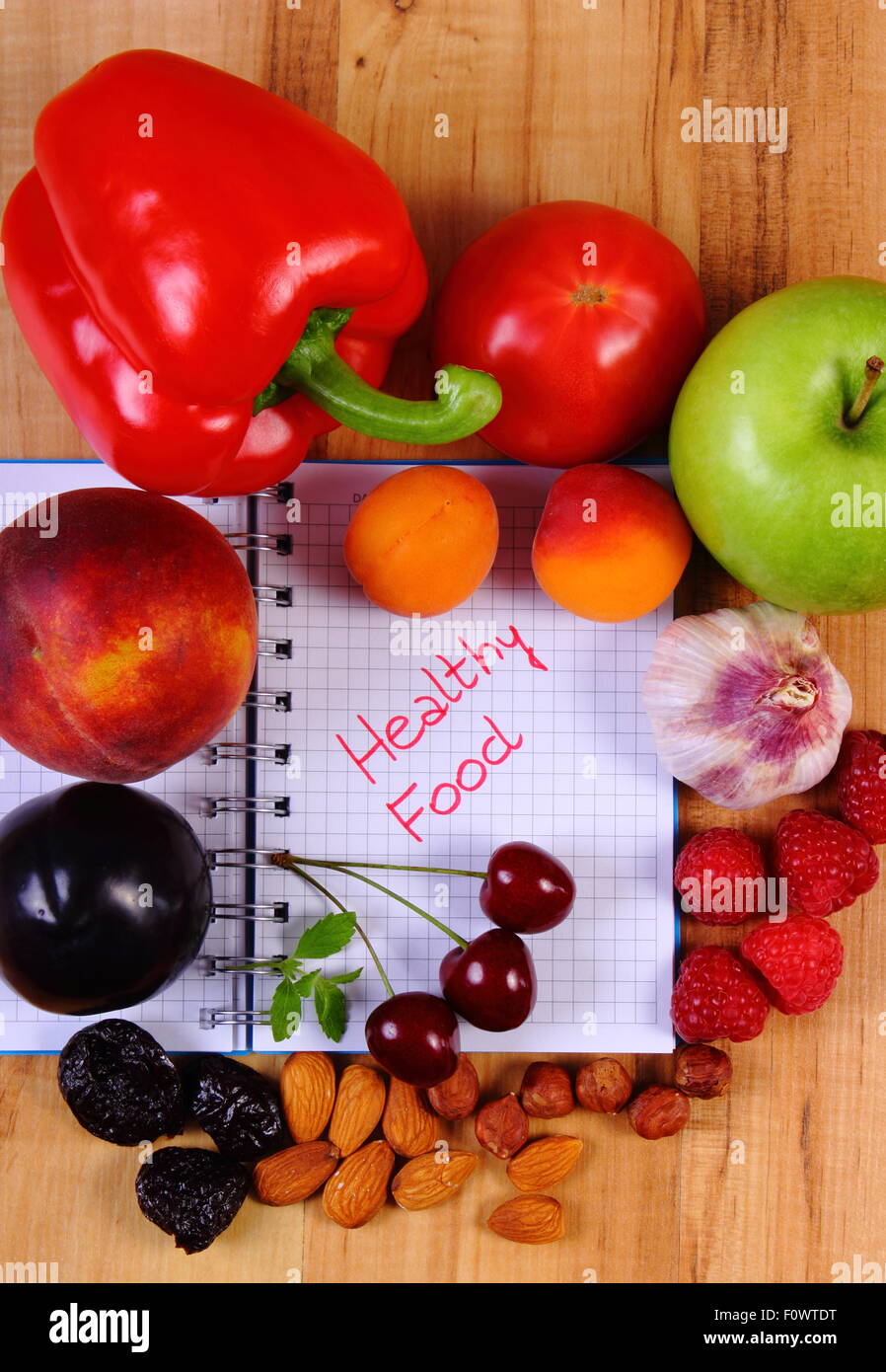 Fresh fruits and vegetables with notebook for writing notes, concept of ...