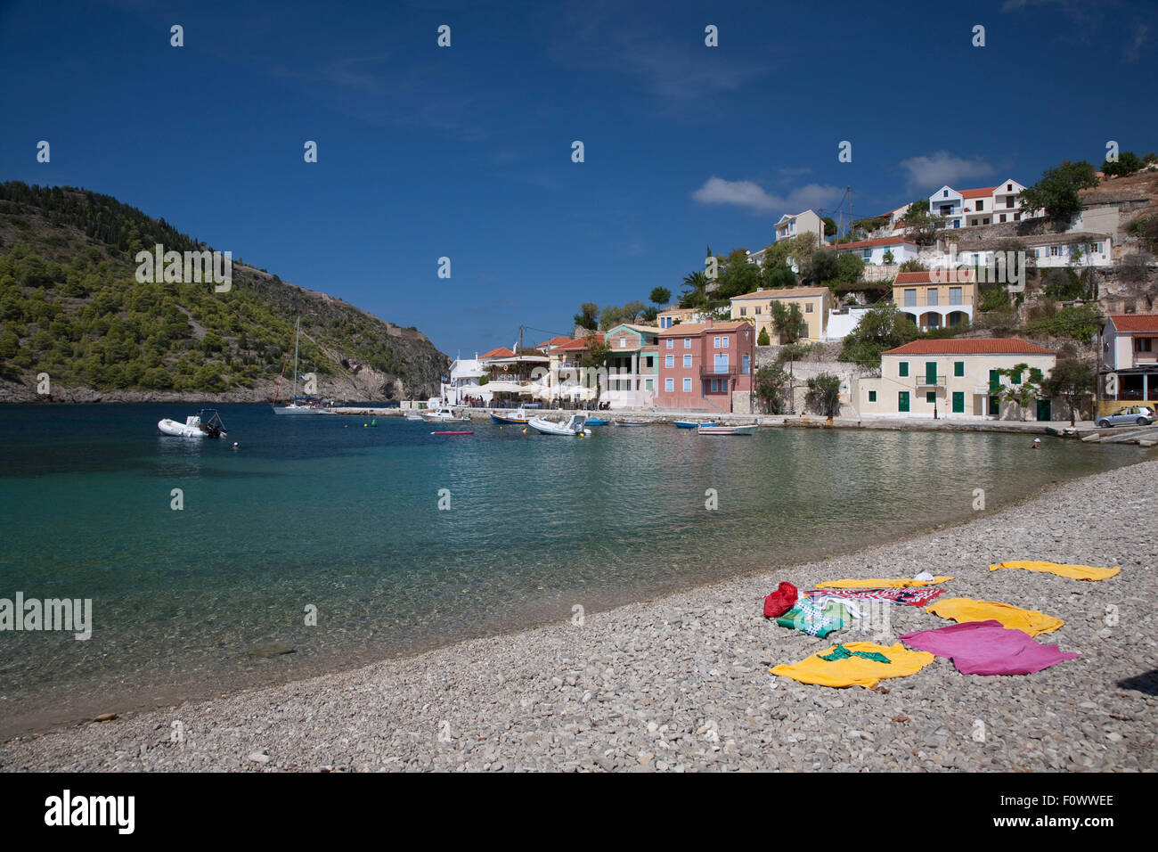 The harbour and beach in the Bay of Assos on the Greek Island of ...