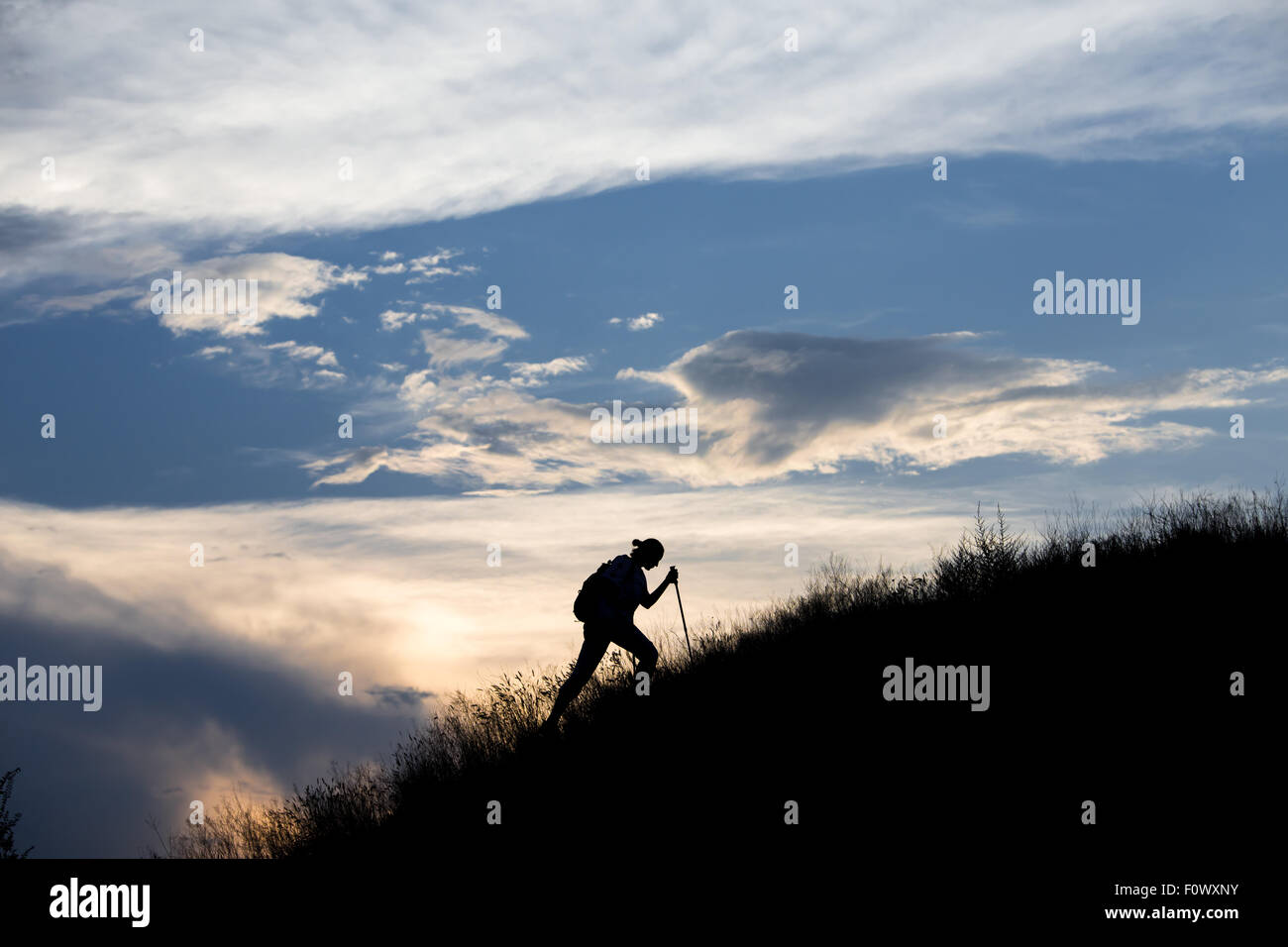 Silhouette of person heavy walking toward the summit Stock Photo - Alamy