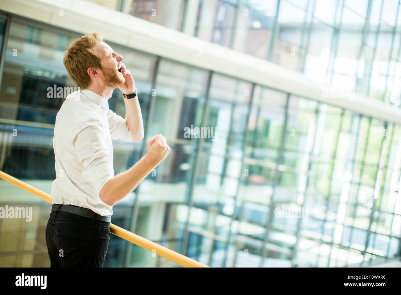 Young man with mobile phone Stock Photo - Alamy