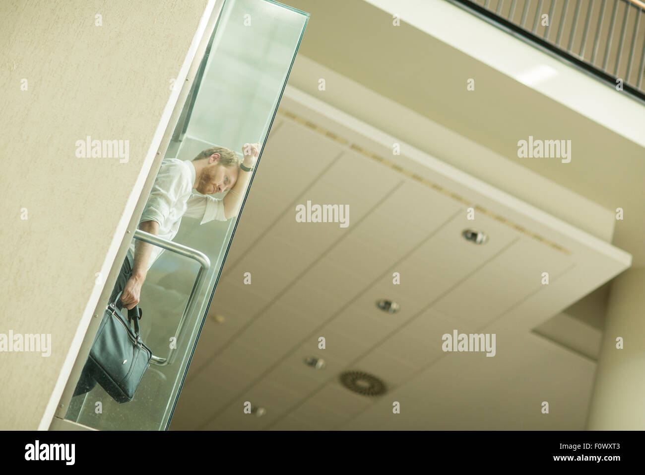 Man lift elevator hi-res stock photography and images - Alamy