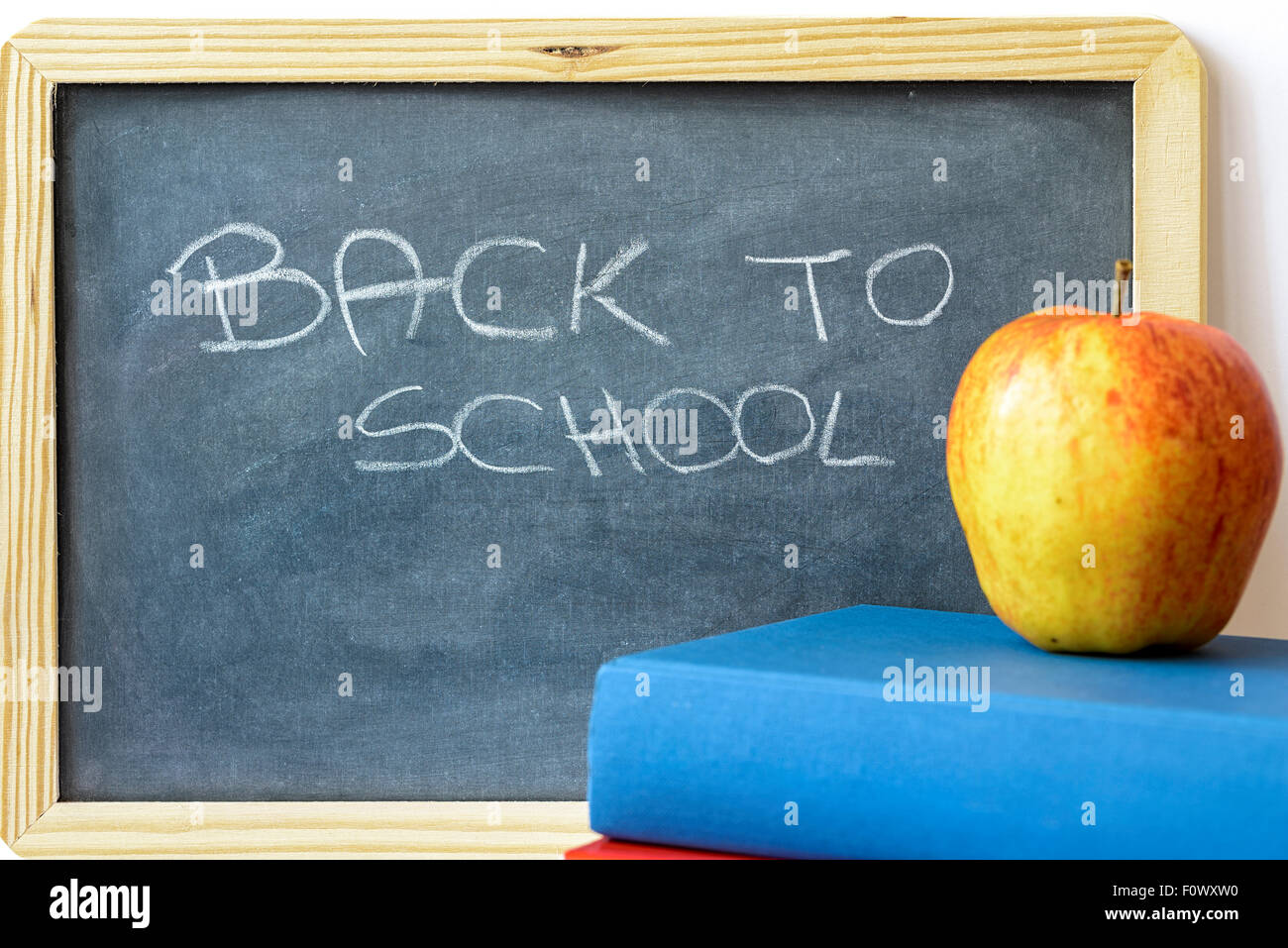 back to school concept with book and apple Stock Photo - Alamy