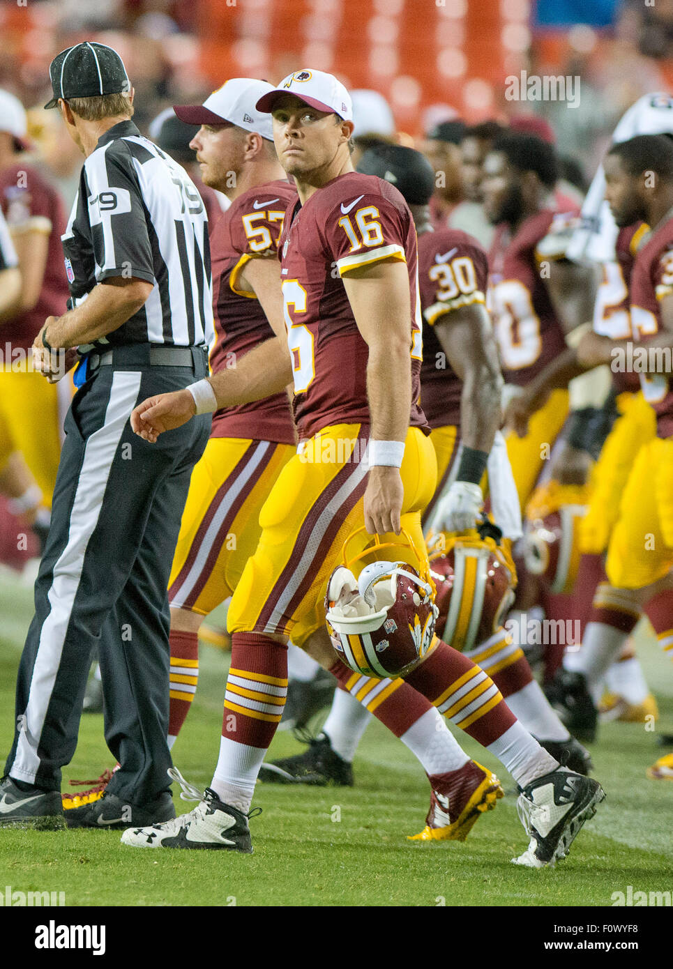 Washington Redskins quarterback Colt McCoy (16) leaves the sideline to ...