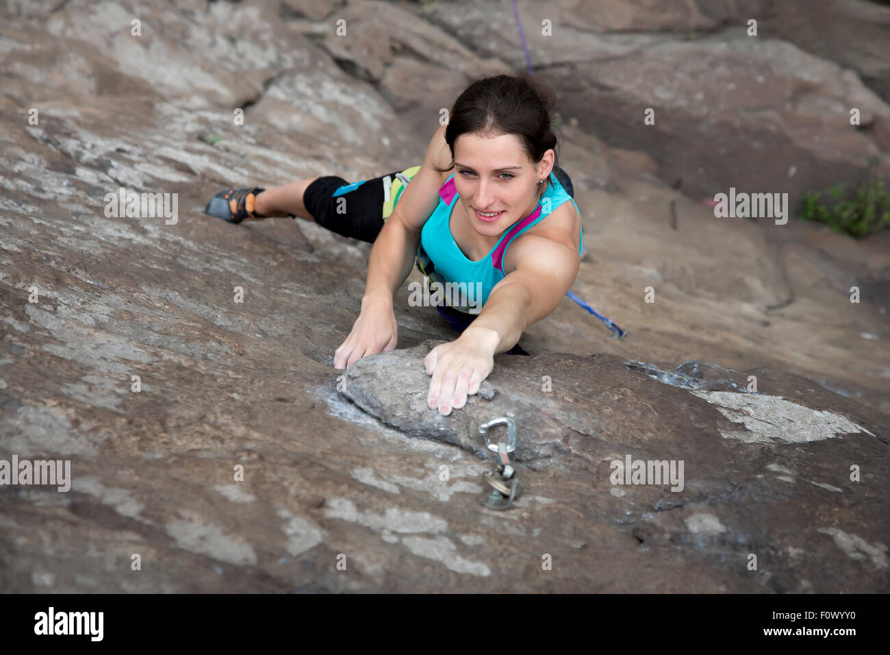 Cute young female extreme climber Stock Photo - Alamy