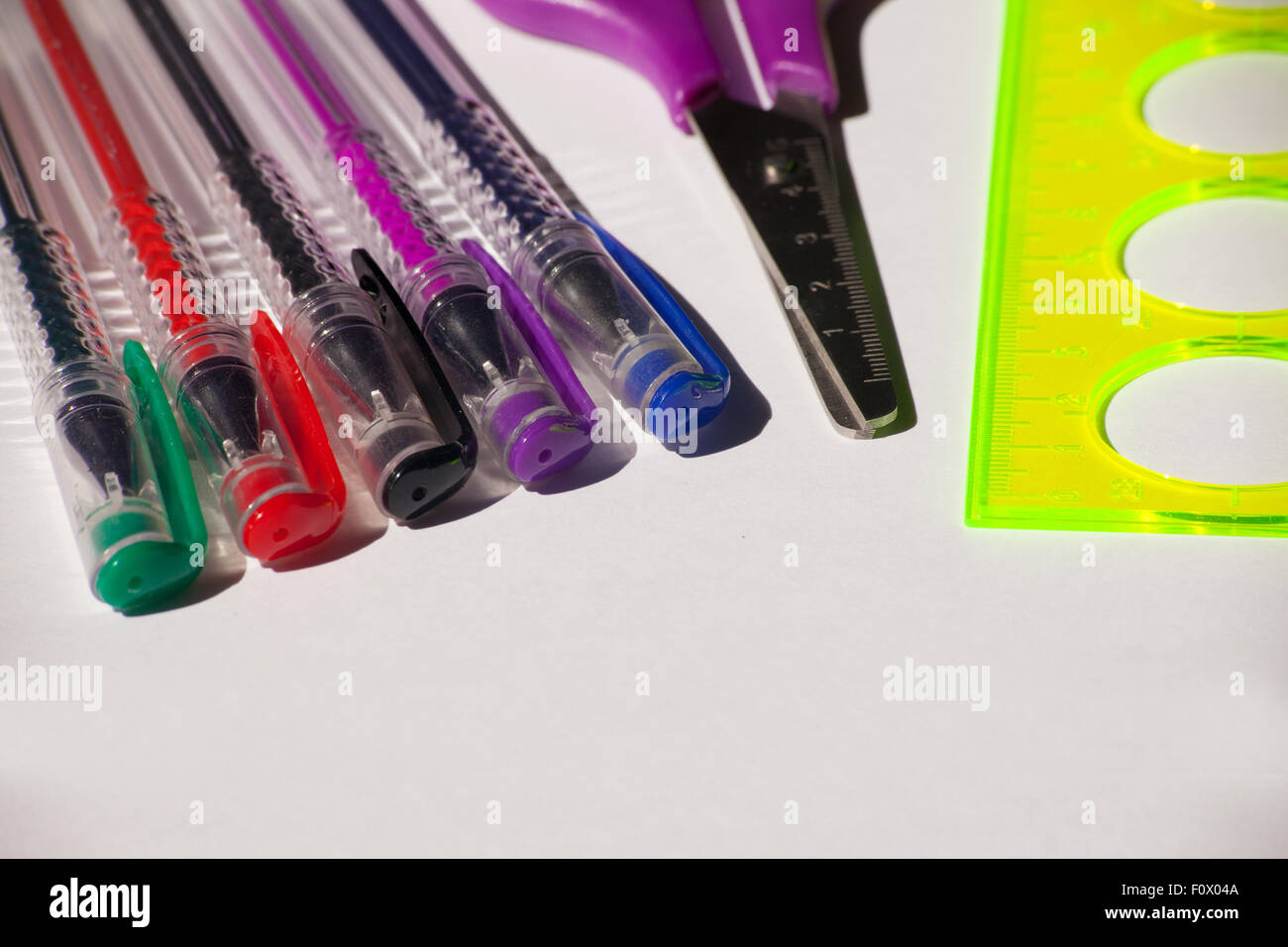 colored pens, scissors and ruler closeup on light bacground Stock Photo ...