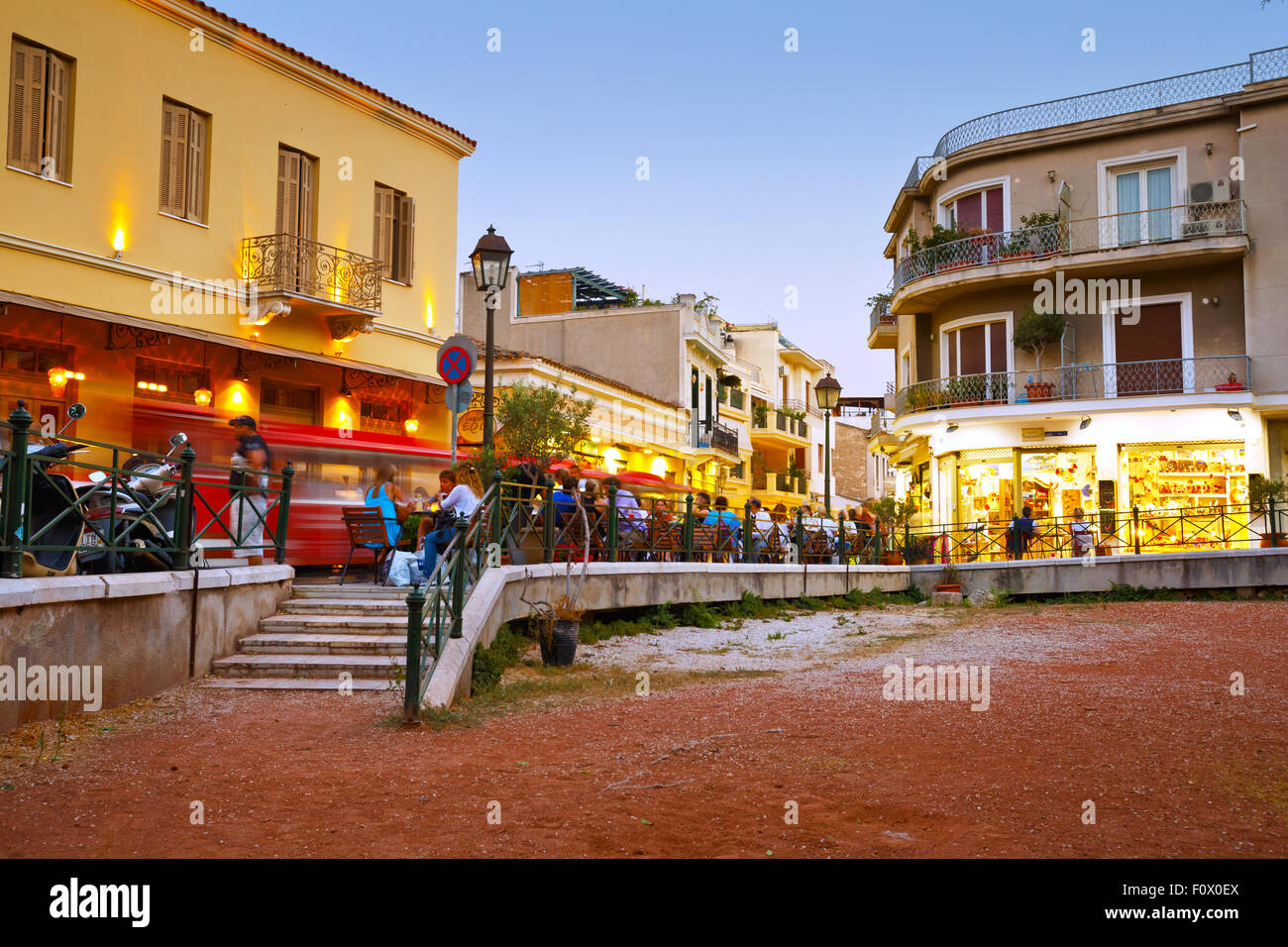 An archaeological site in Plaka surrounded by shops and coffee shops ...