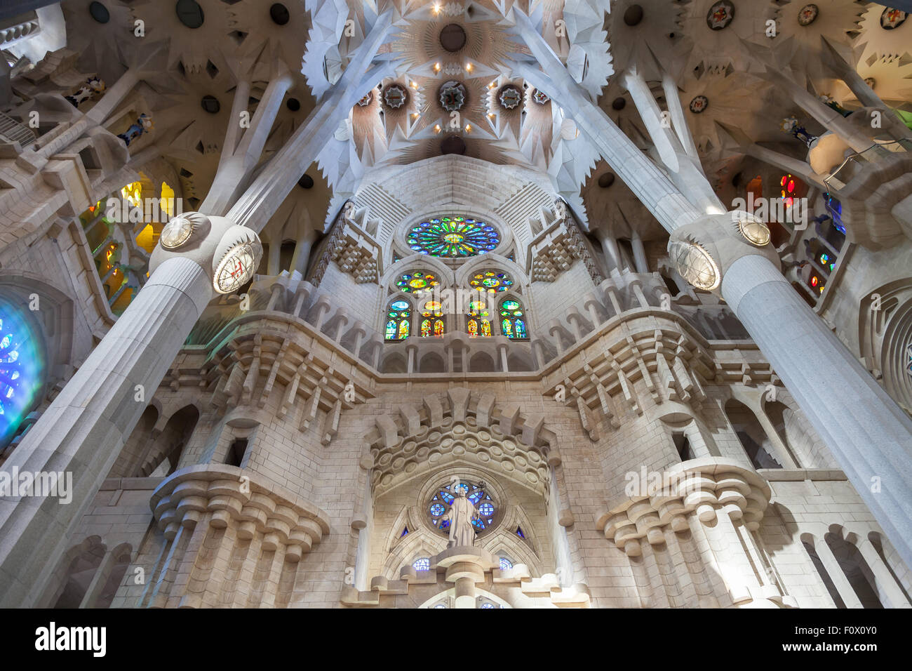 The sun shines through the stained glass windows of Gaudi's masterpiece ...