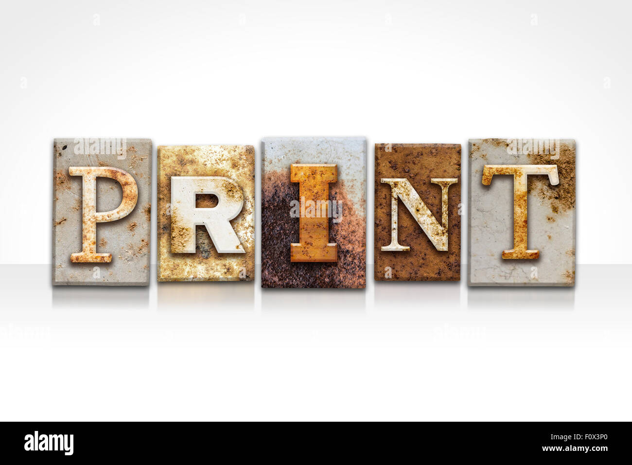 The word "PRINT" written in rusty metal letterpress type isolated on a ...