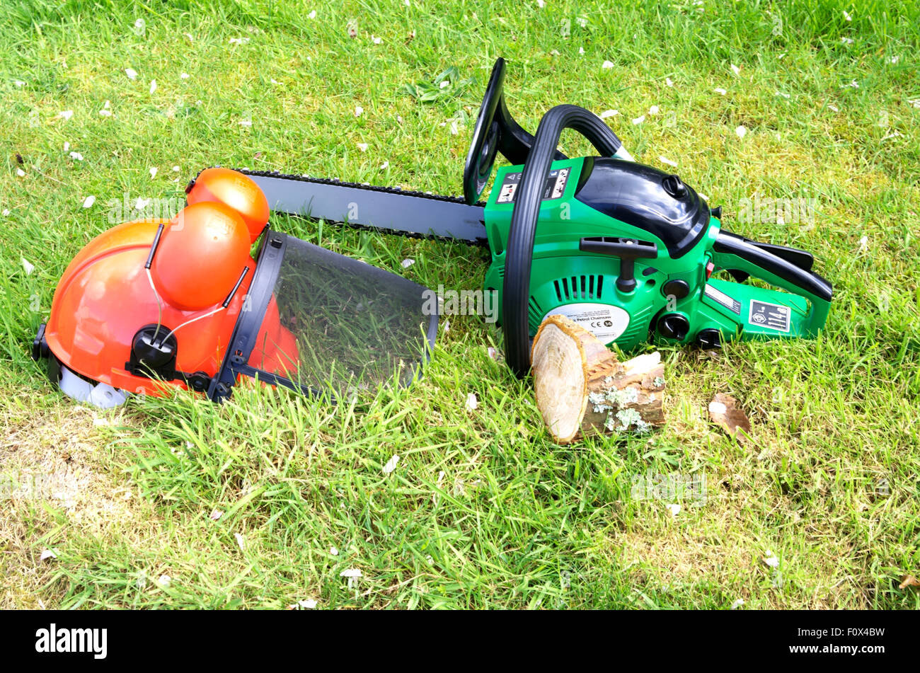 New chainsaw on grass background Stock Photo - Alamy