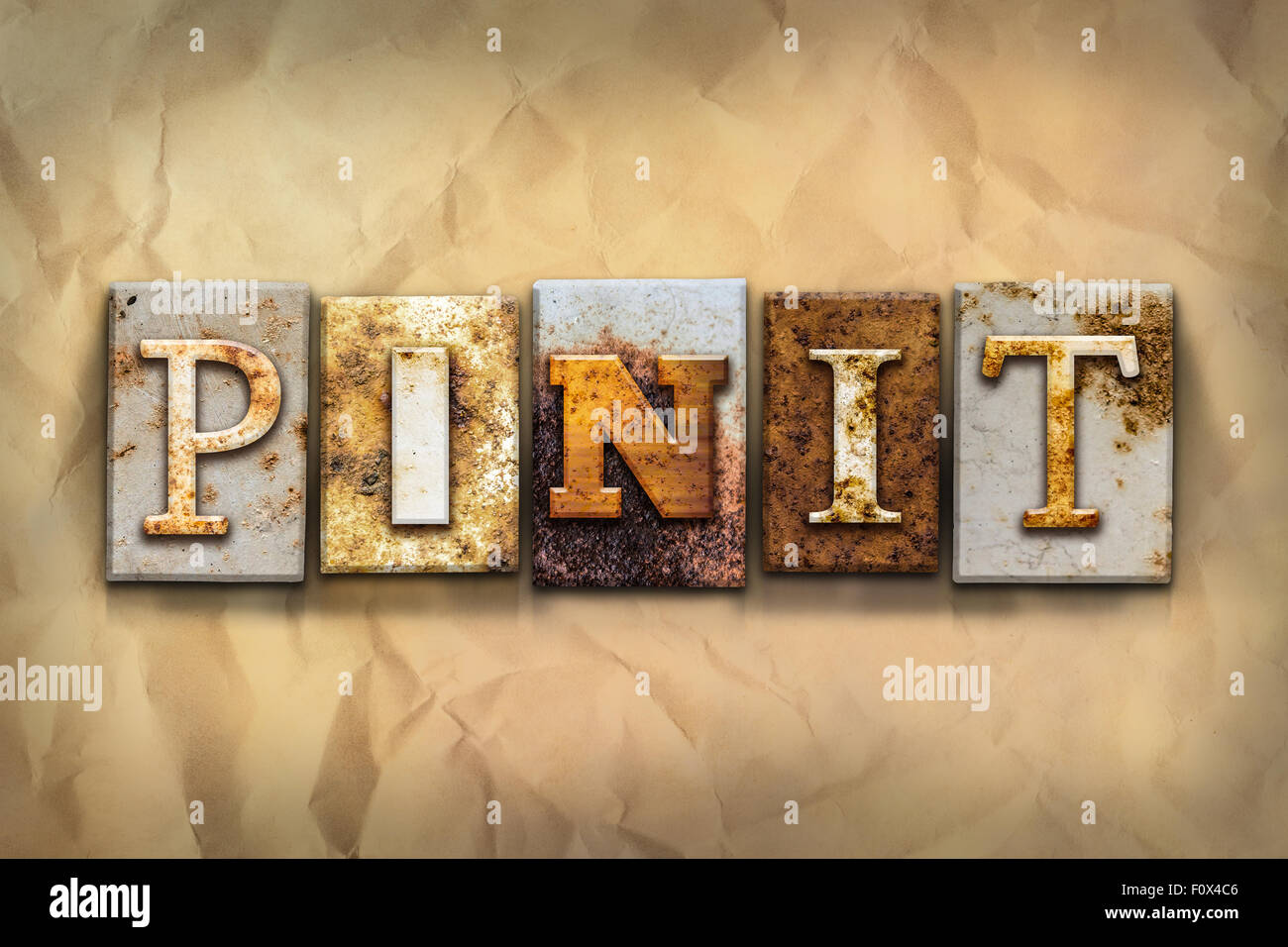 The word "PIN IT" written in rusty metal letterpress type on a crumbled ...