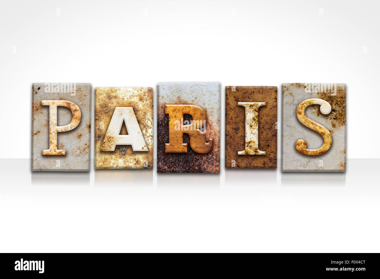 The word "PARIS" written in rusty metal letterpress type isolated on a ...