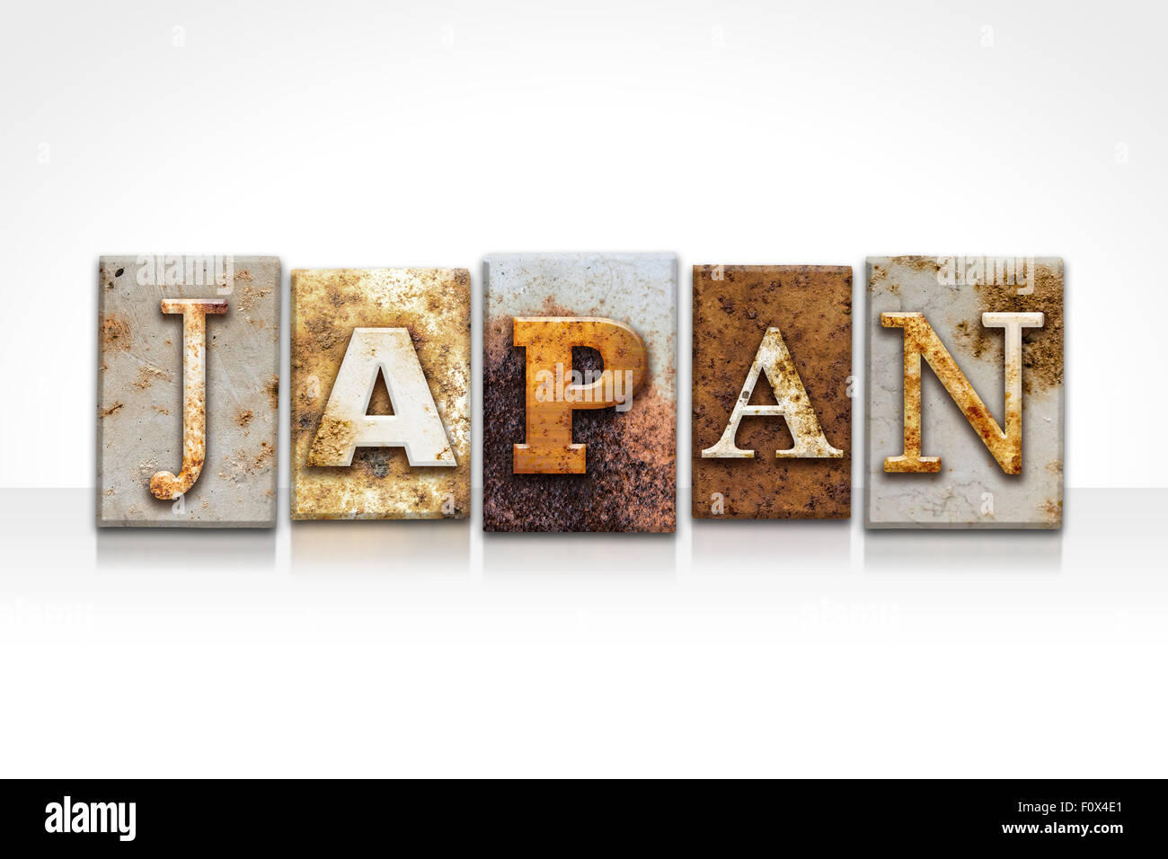 The word "JAPAN" written in rusty metal letterpress type isolated on a ...