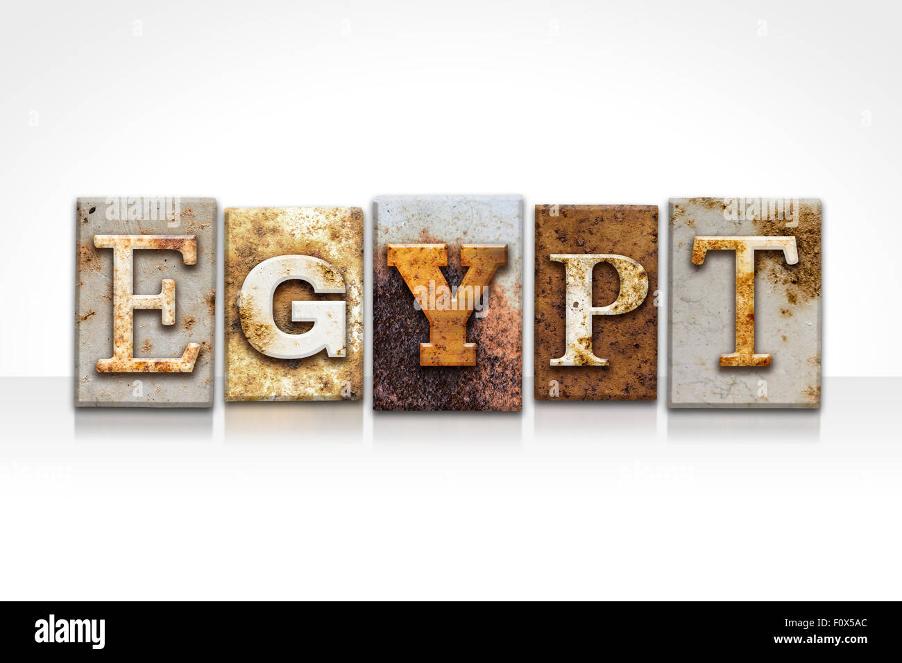 The word "EGYPT" written in rusty metal letterpress type isolated on a ...